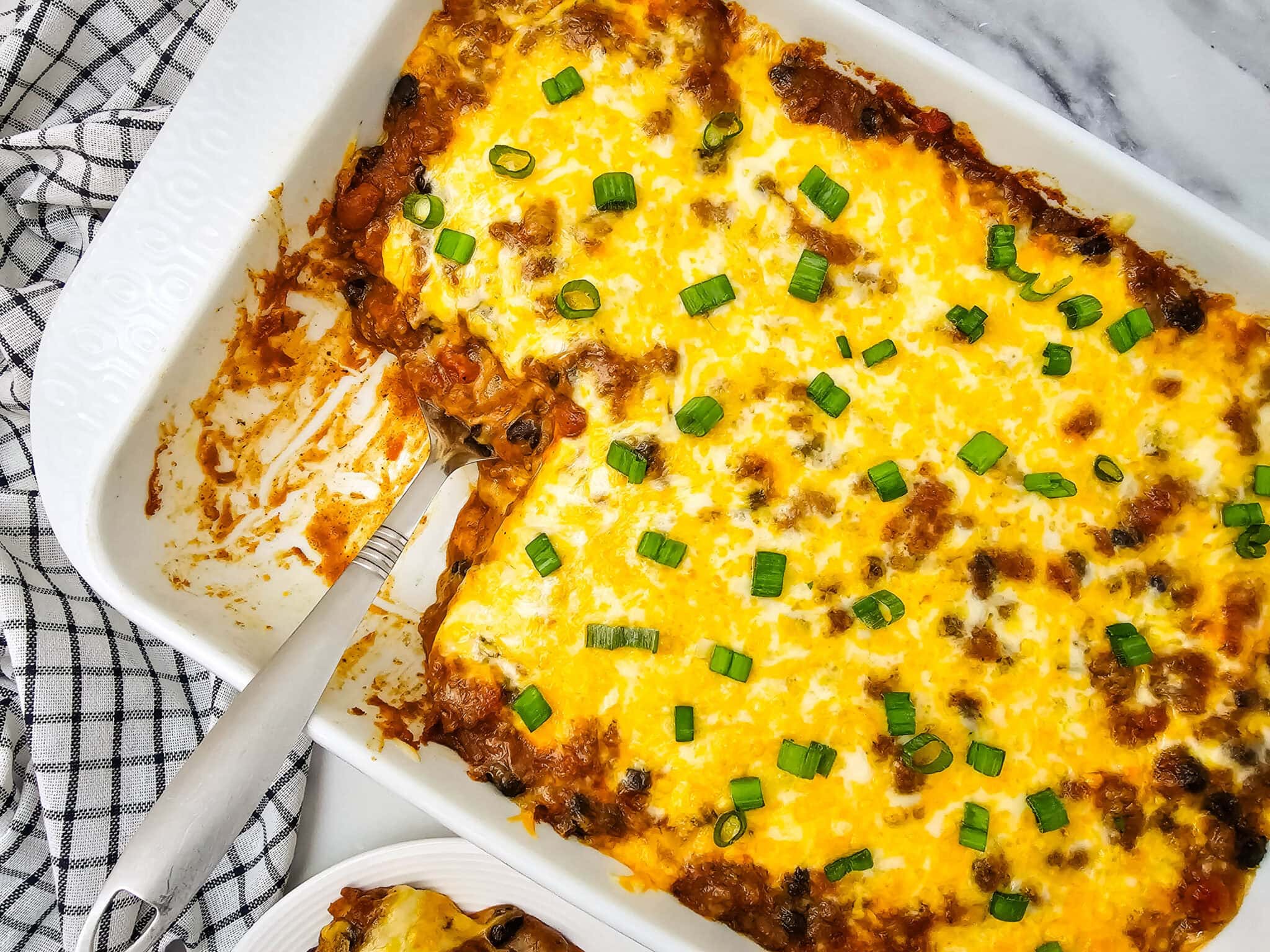 Mexican Lasagna Tortilla Casserole - Bite-Sized Bash